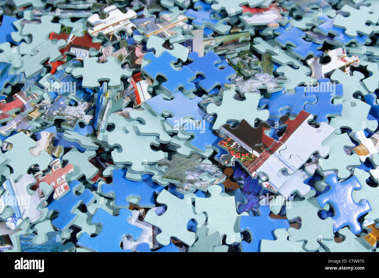 Pieces of puzzle spilled on table, abstract background Stock Photo - Alamy