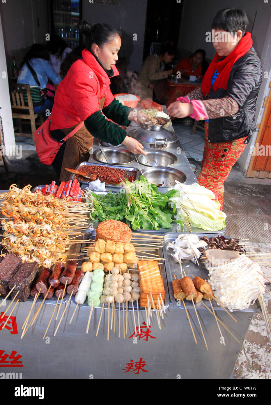 A stand with traditional street food in Fenghuang Stock Photo - Alamy