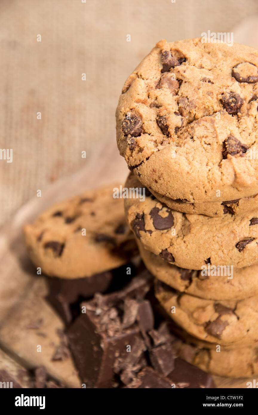 Stacked Cookies with Chocolate on a rustic background Stock Photo - Alamy