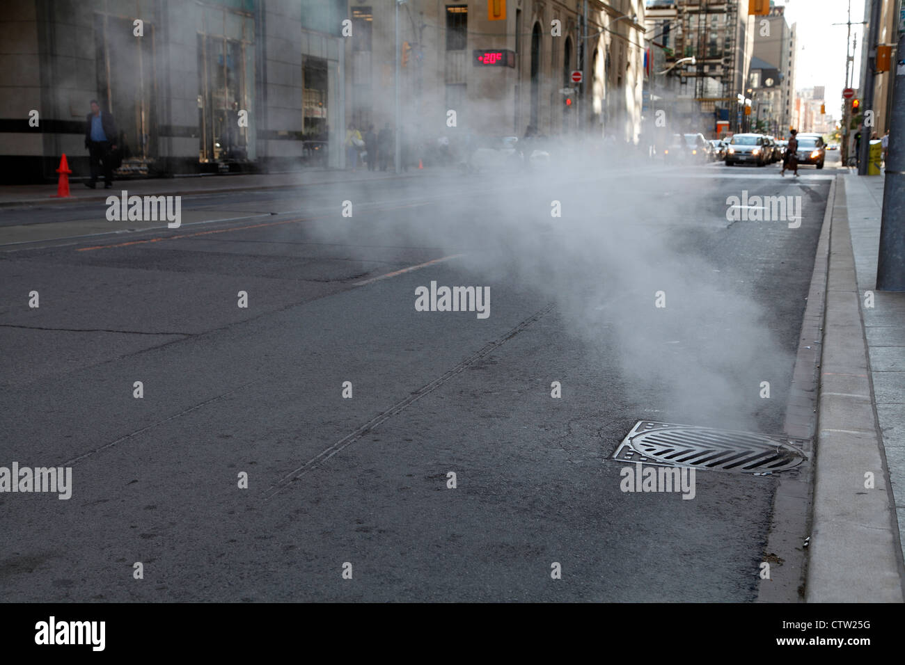 Manhole cover steaming hi-res stock photography and images - Alamy