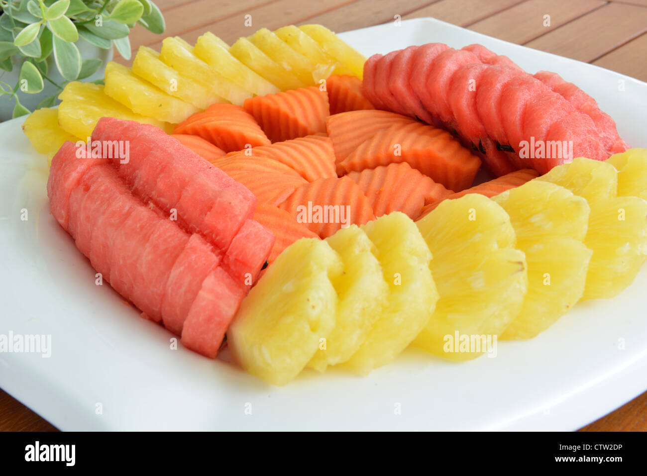 Mixed fruit including papaya, watermelon and pineapple is served on the ...