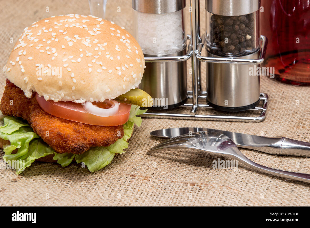 Chicken Burger with ingredients on rustic background Stock Photo - Alamy