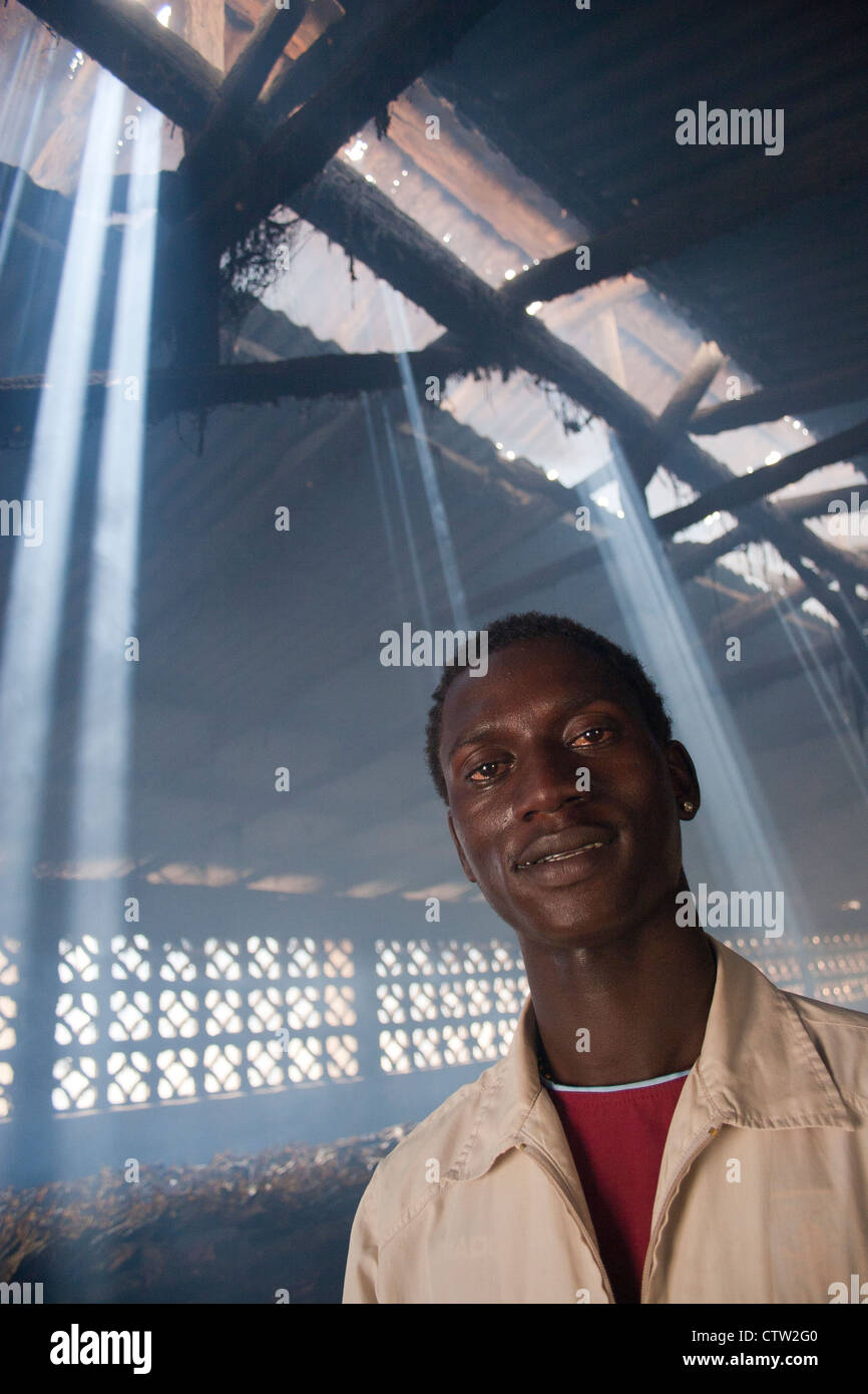 Portrait of man in fish smokehouse, The Gambia, Africa Stock Photo - Alamy