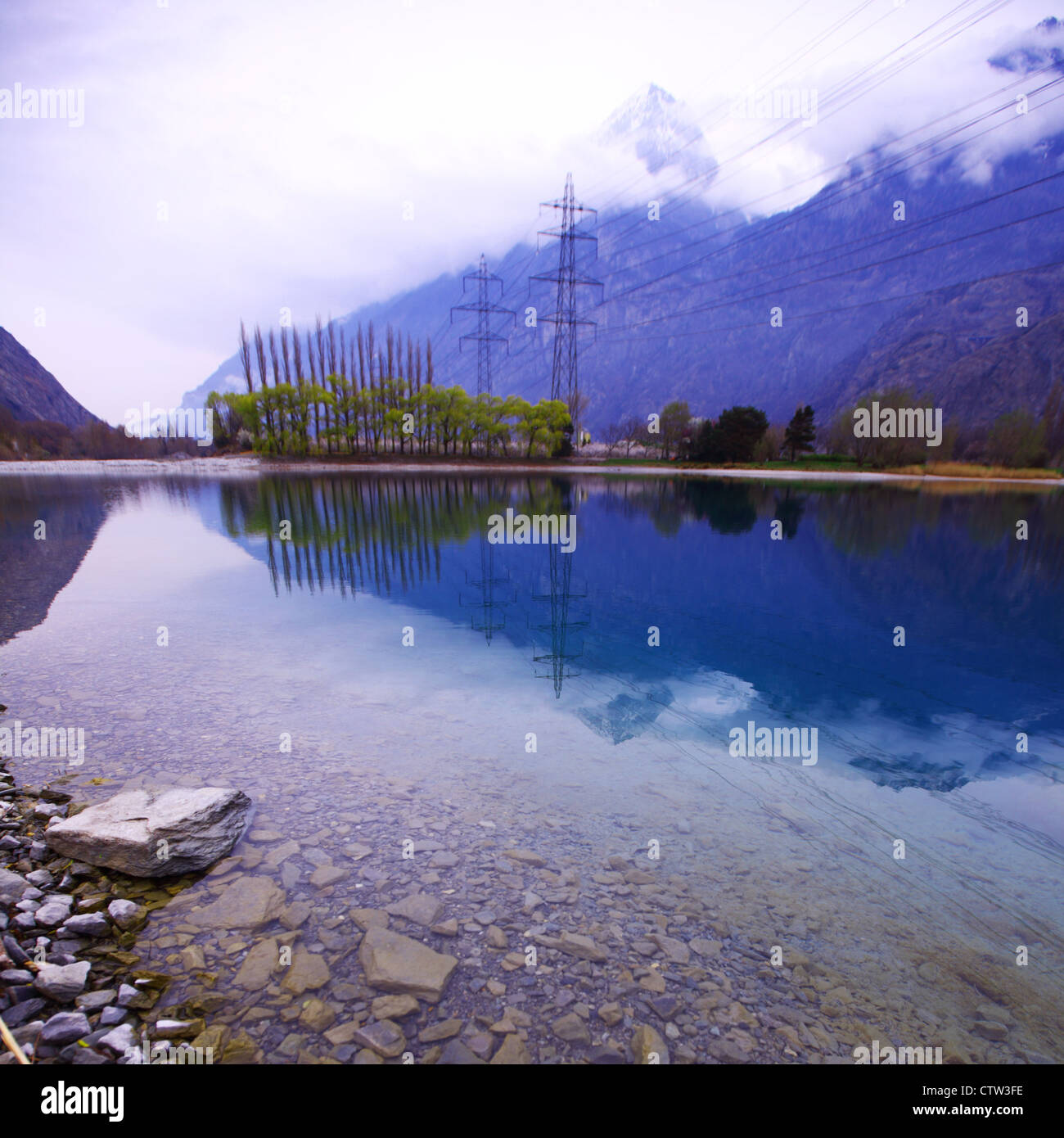 tree reflection in spring mountain lake Stock Photo - Alamy