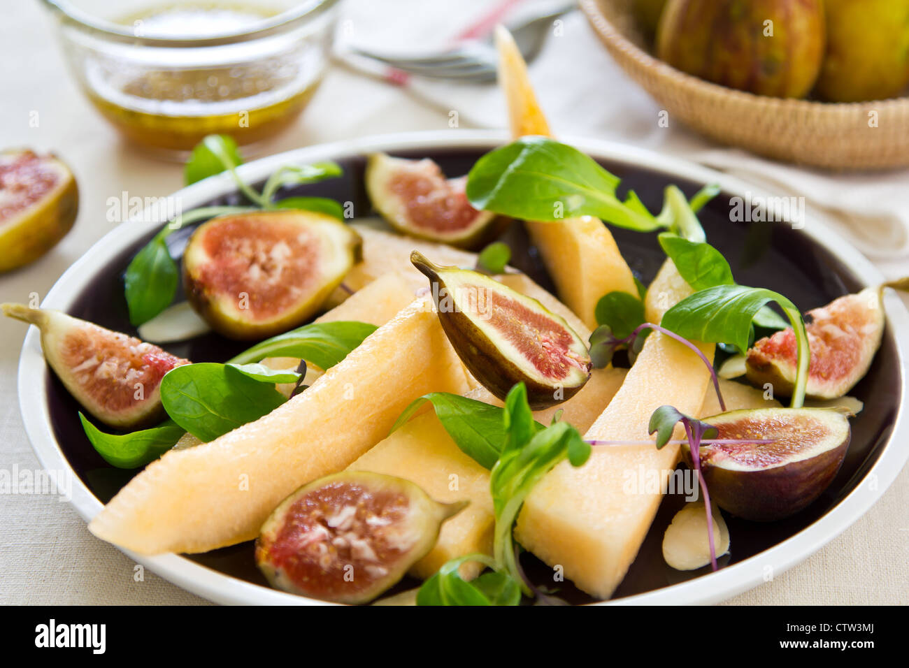 Fig,Melon and almond salad Stock Photo - Alamy