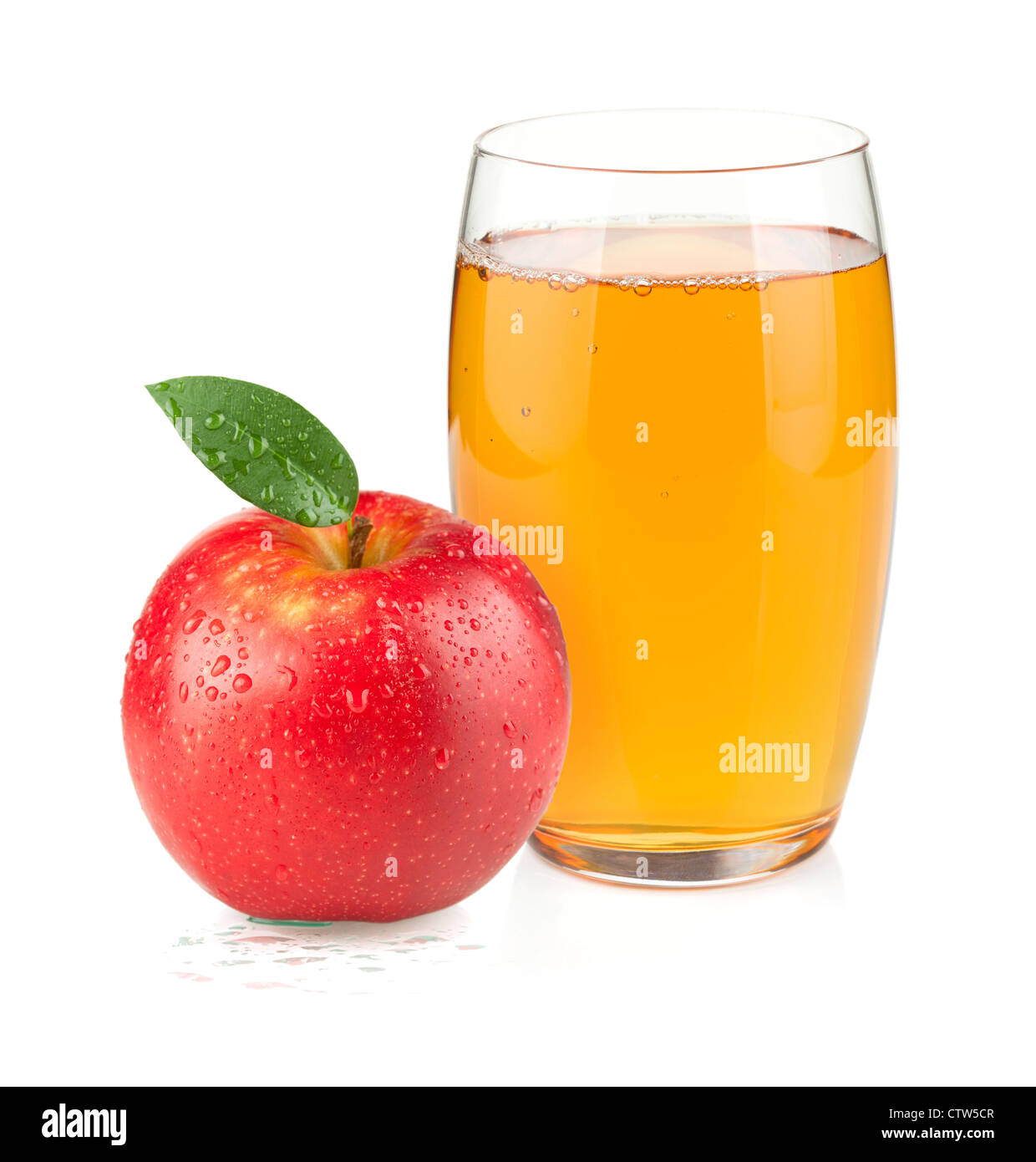 Apple juice in a glass and red apple. Isolated on white background ...