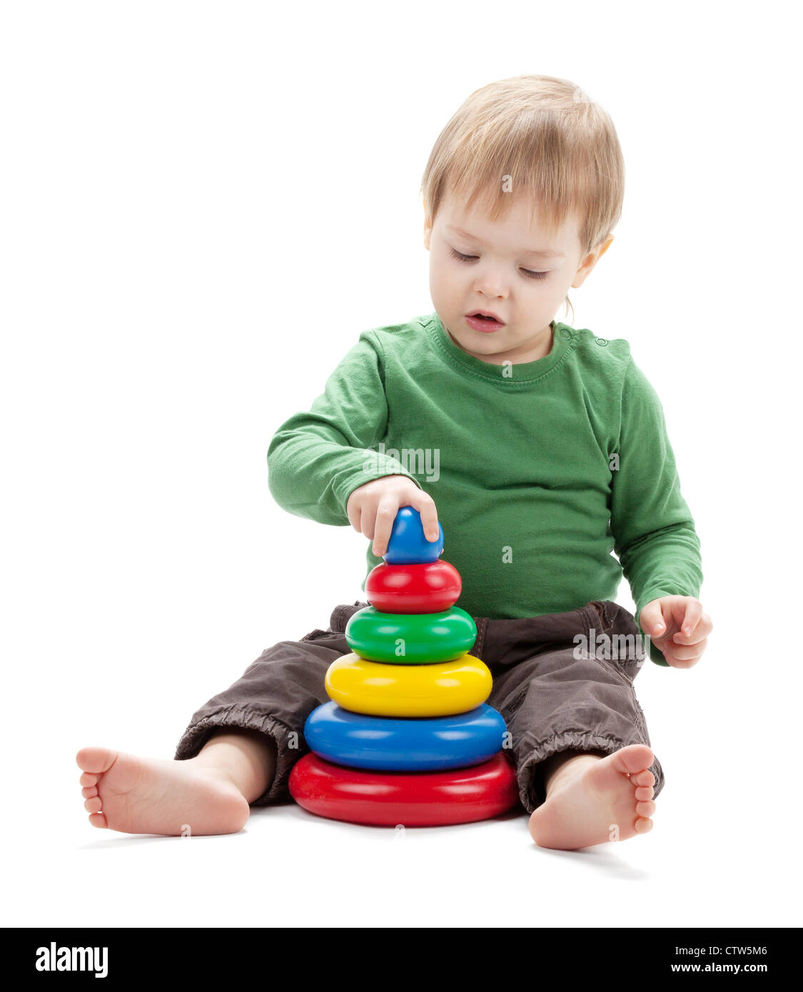 Small baby with a toy pyramid. Isolated on white background Stock Photo ...