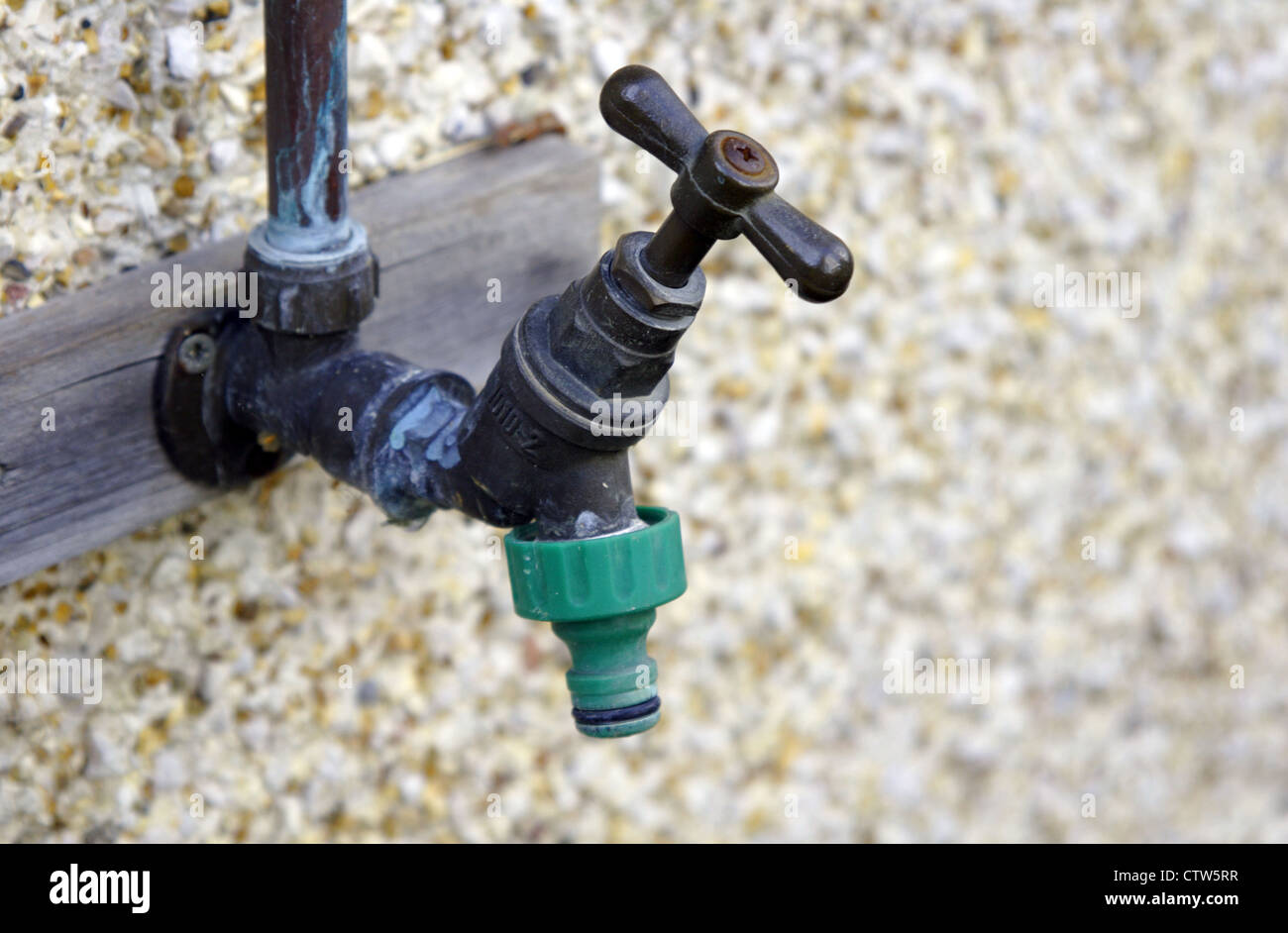 Wall mounted outdoor tap Stock Photo - Alamy