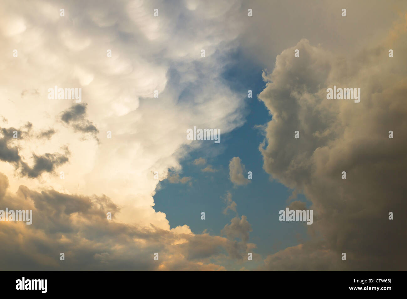 Blue sky and building storm clouds in Maine Stock Photo - Alamy