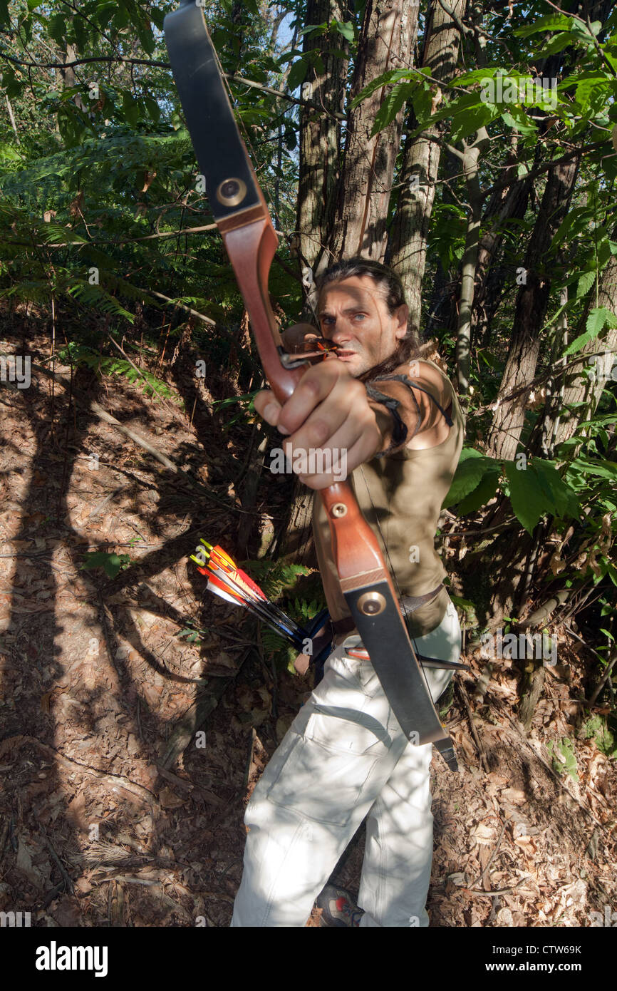 angry archer pointing his bow against the camera Stock Photo - Alamy
