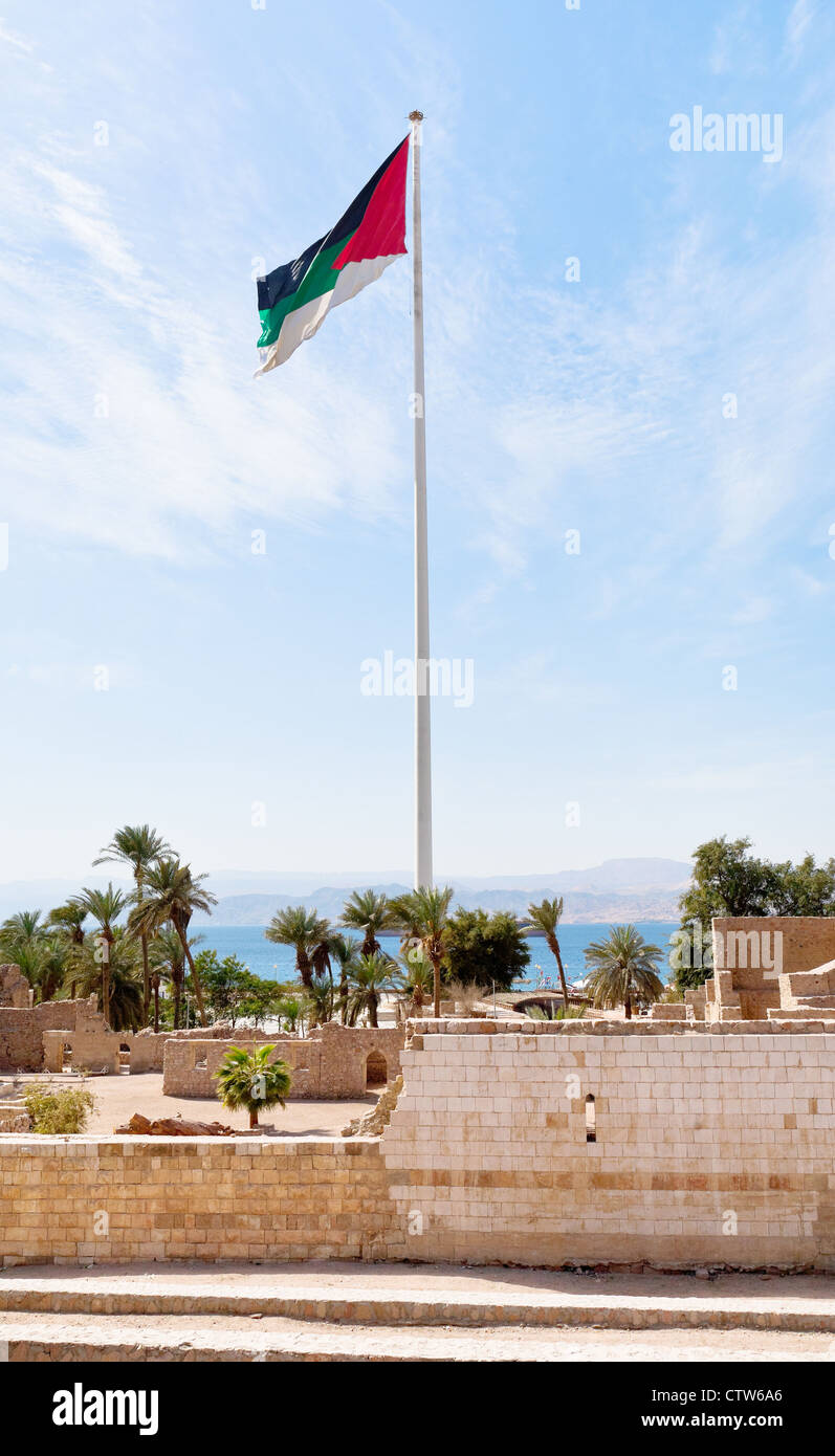 The Aqaba Flagpole under ruins of medieval Mamluks Aqaba fort Stock ...