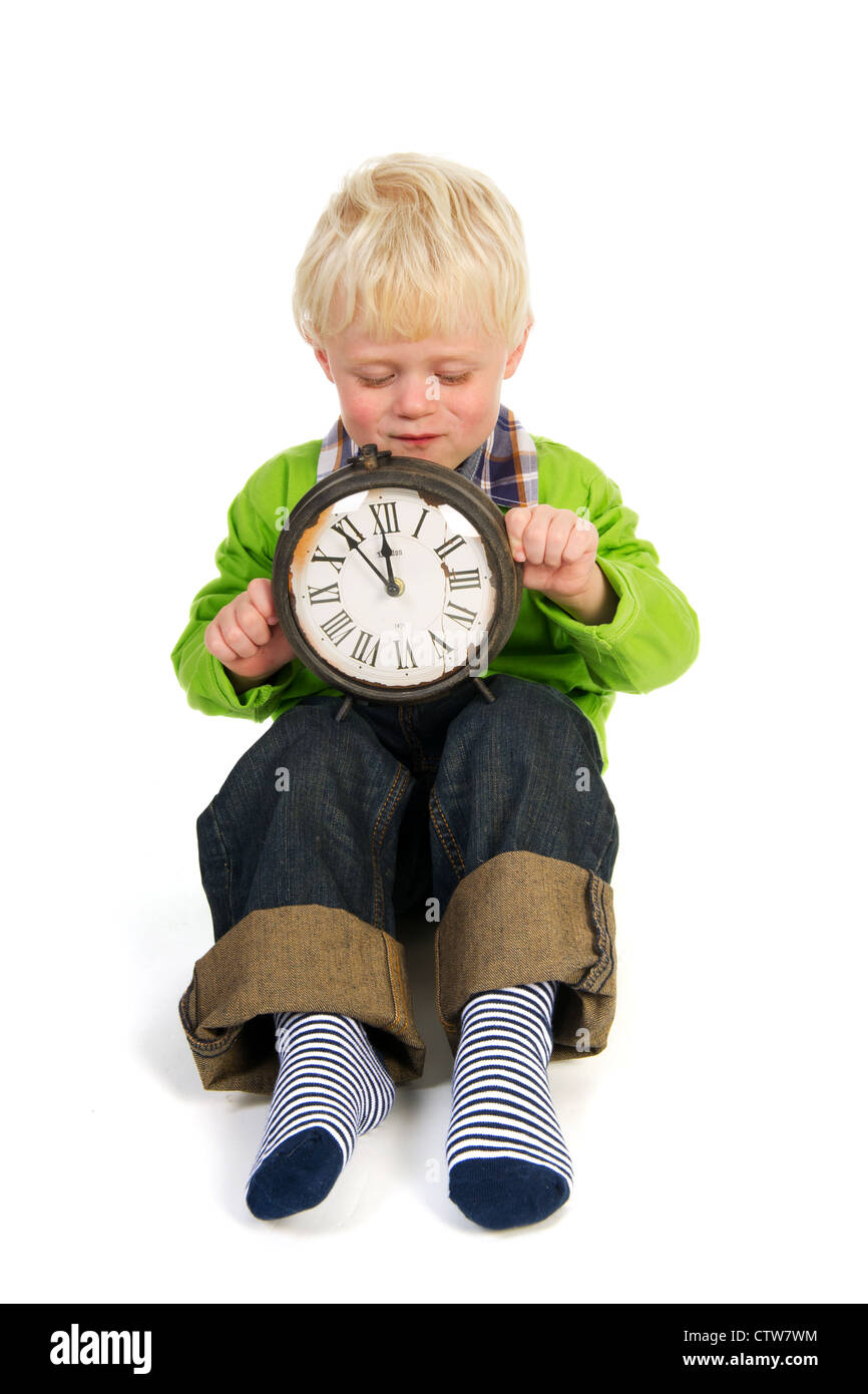 Little blond child with old clock five for twelve Stock Photo - Alamy