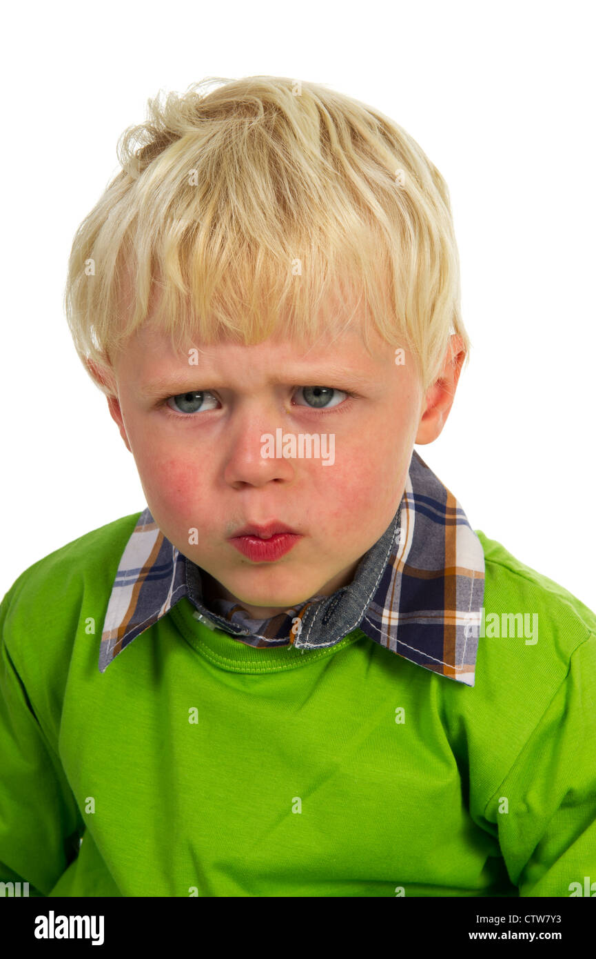 Portrait of an angry little blond boy Stock Photo - Alamy