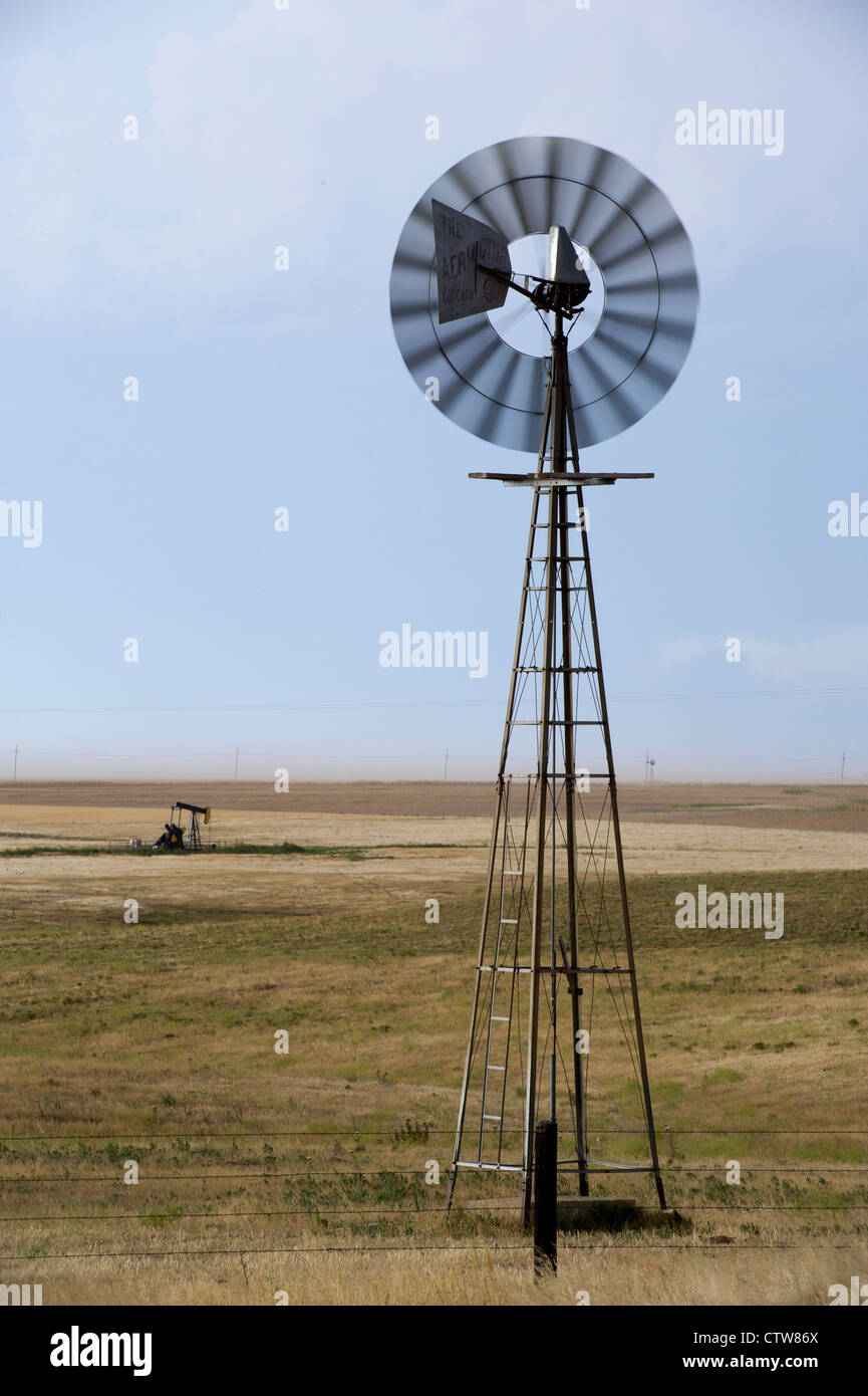 Oil derrick and windmill, old and older. Near Ogallah, Kansas. July ...