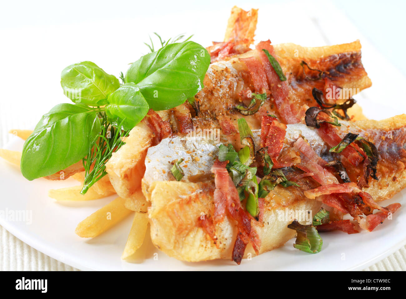 Pan fried fish fillets with French fries Stock Photo - Alamy