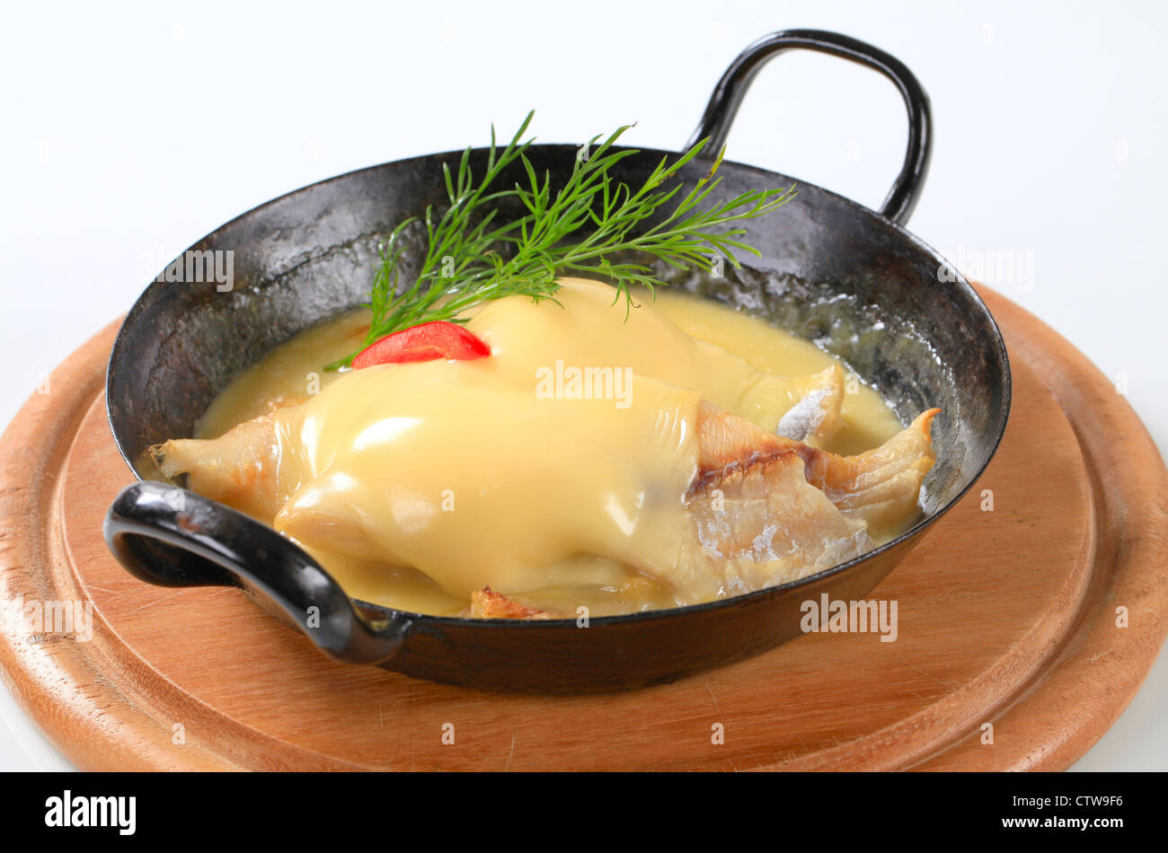 White fish fillets with Hollandaise sauce Stock Photo - Alamy