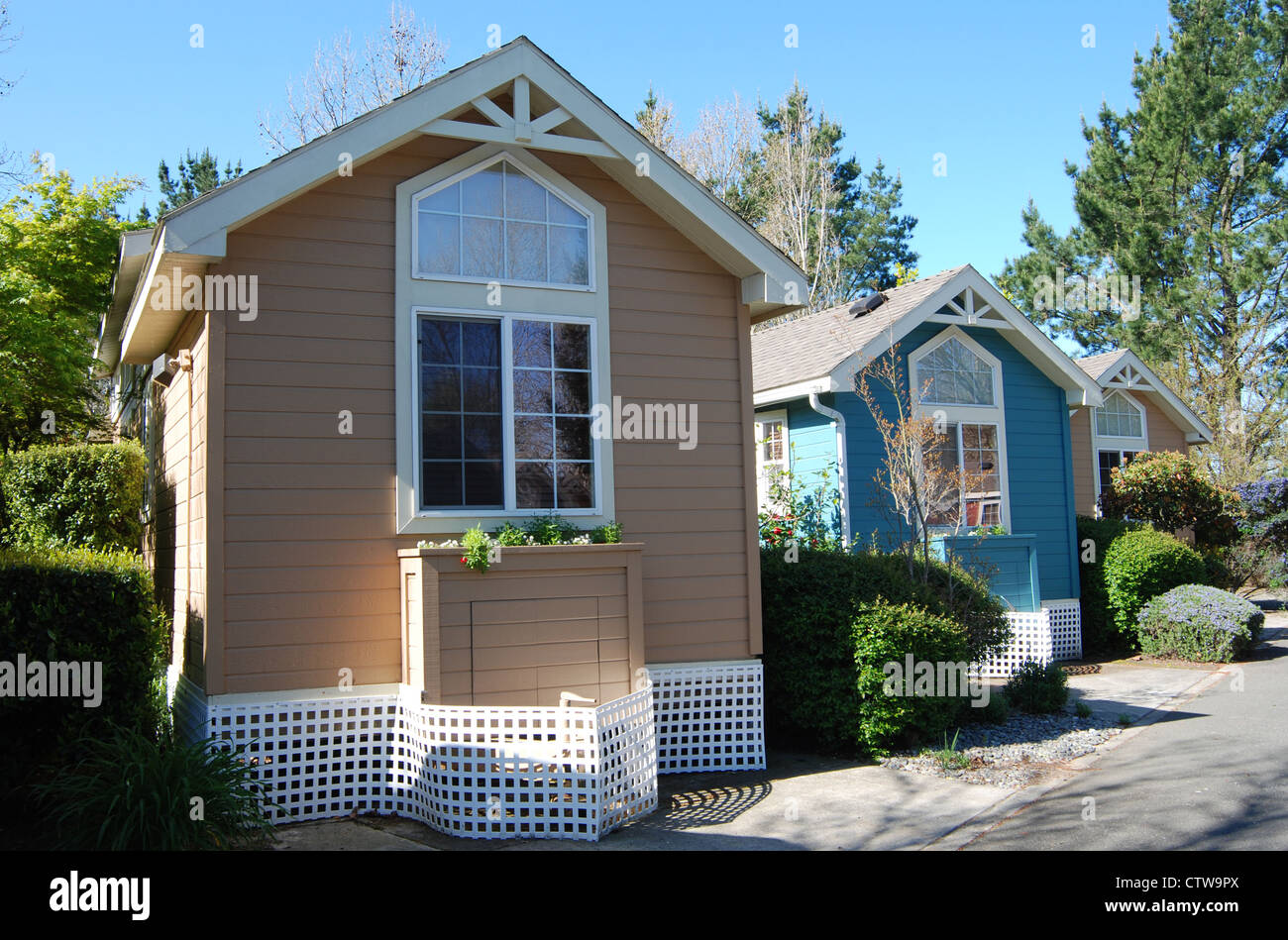 Three very small houses next to each other. Small eco-footprint Stock ...