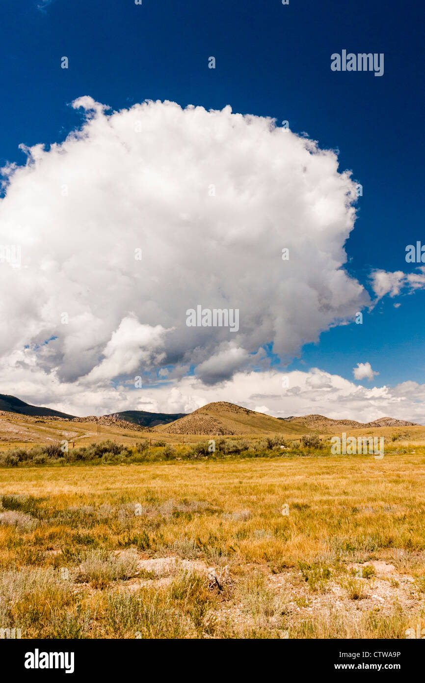 "Big Sky" cloud formations over barren-looking mountains in ...