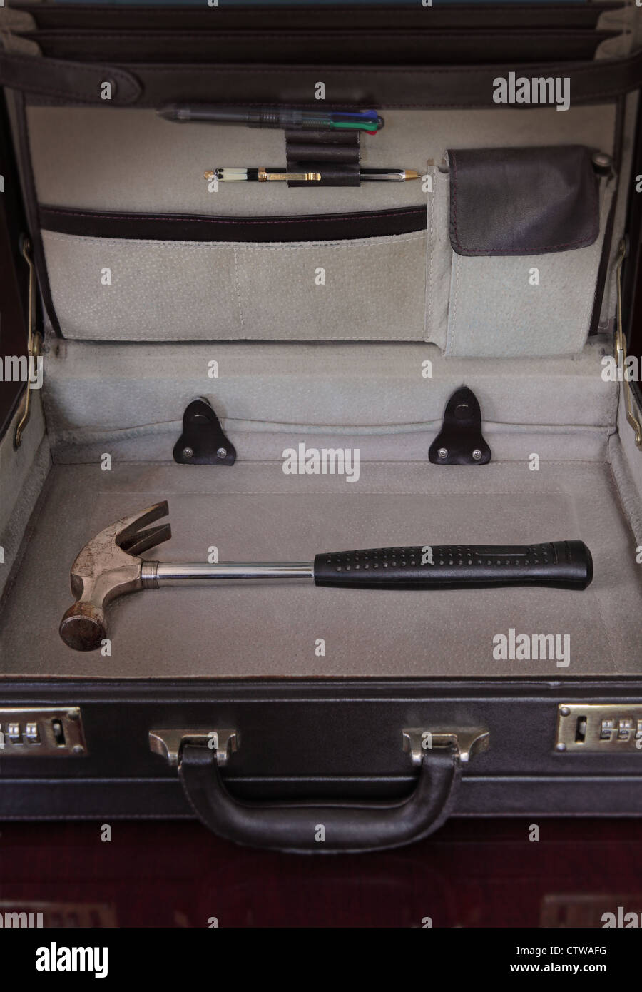 in the briefcase we see a hammer. This image refers to someone who ...