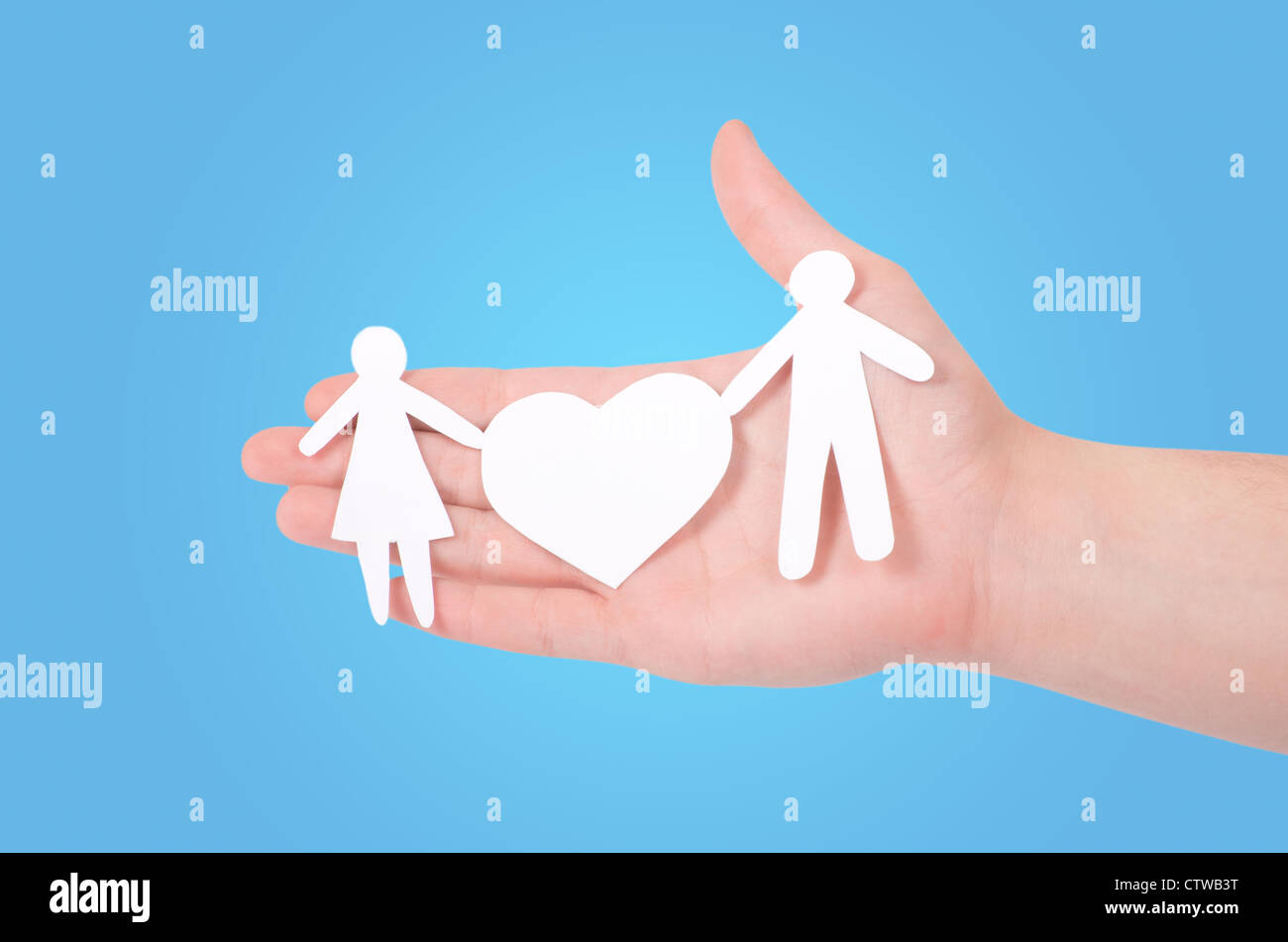 paper family in hands Stock Photo - Alamy