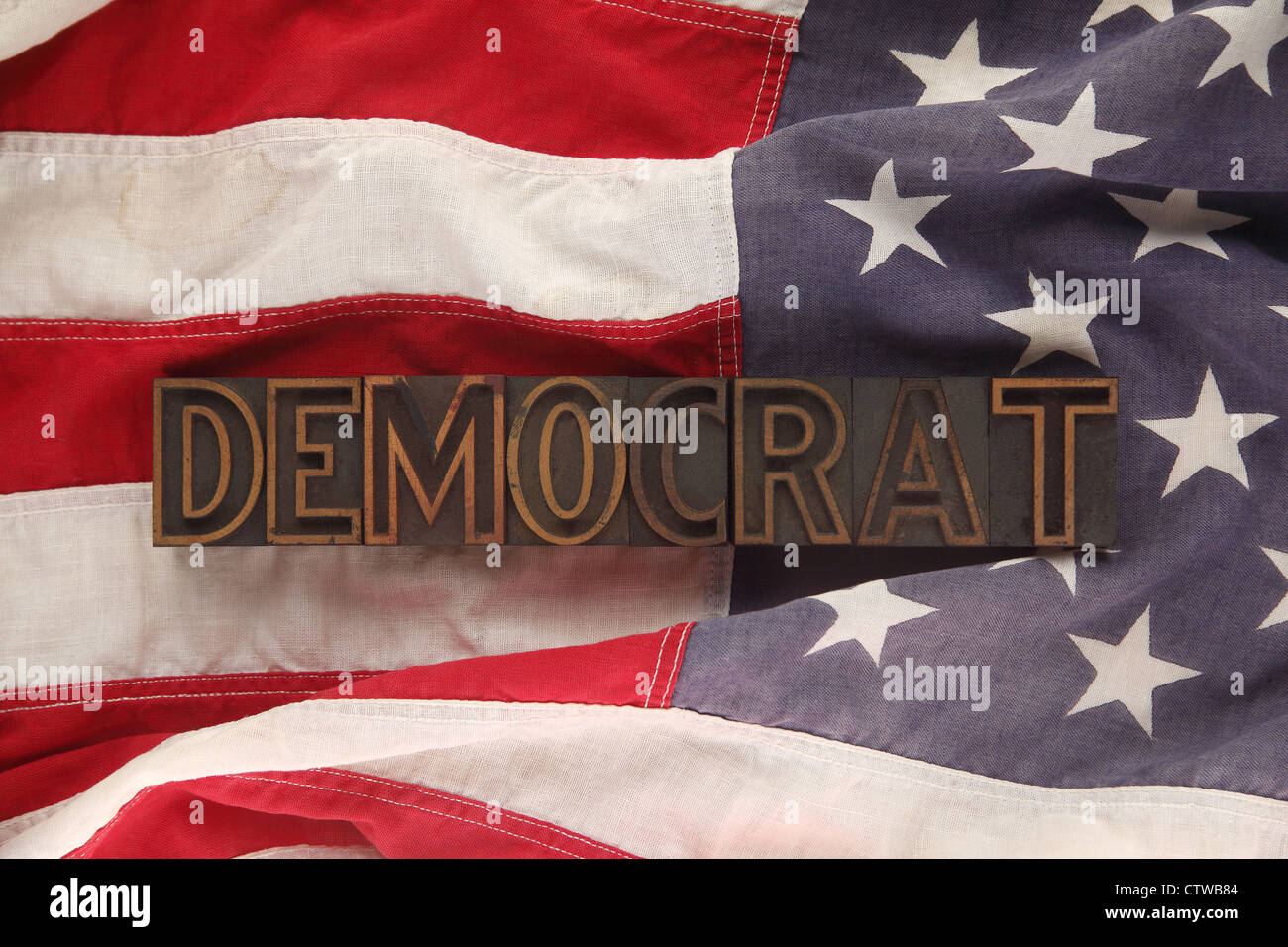 the word Democrat in letterpress wood type on an old American flag ...