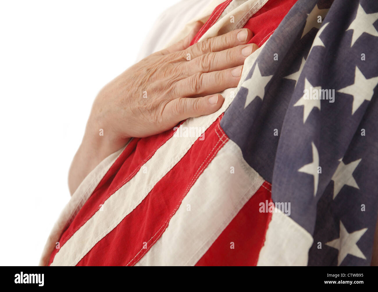 a man's hand on an old American flag draped over his shoulder Stock ...