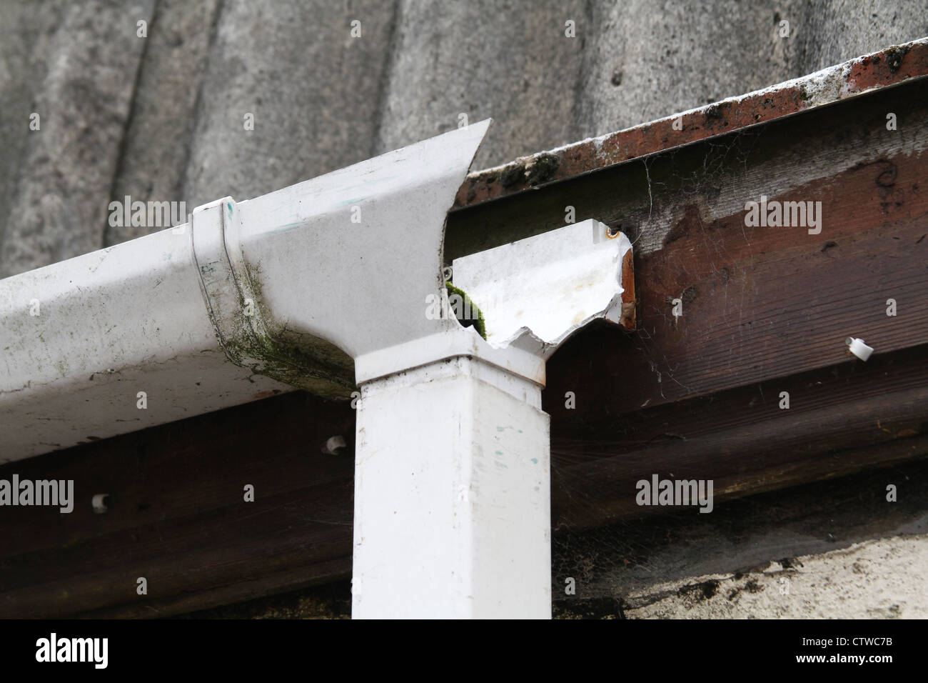 Broken drain guttering Stock Photo - Alamy