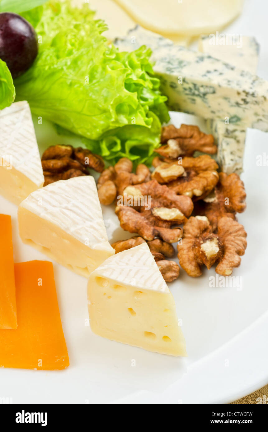 cheese with lettuce, grapes and nuts closeup Stock Photo - Alamy
