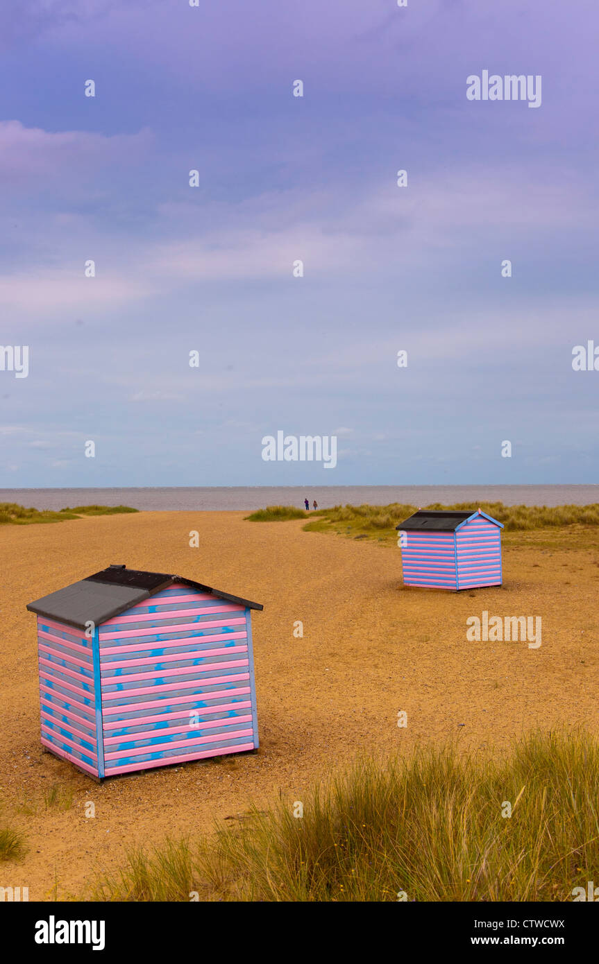 Isolated colourful beach huts on sand beach and dunes Stock Photo - Alamy