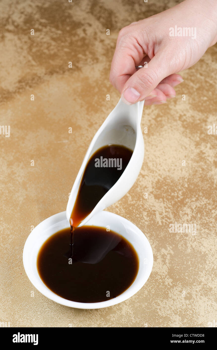 soy sauce poured on a white Stock Photo - Alamy