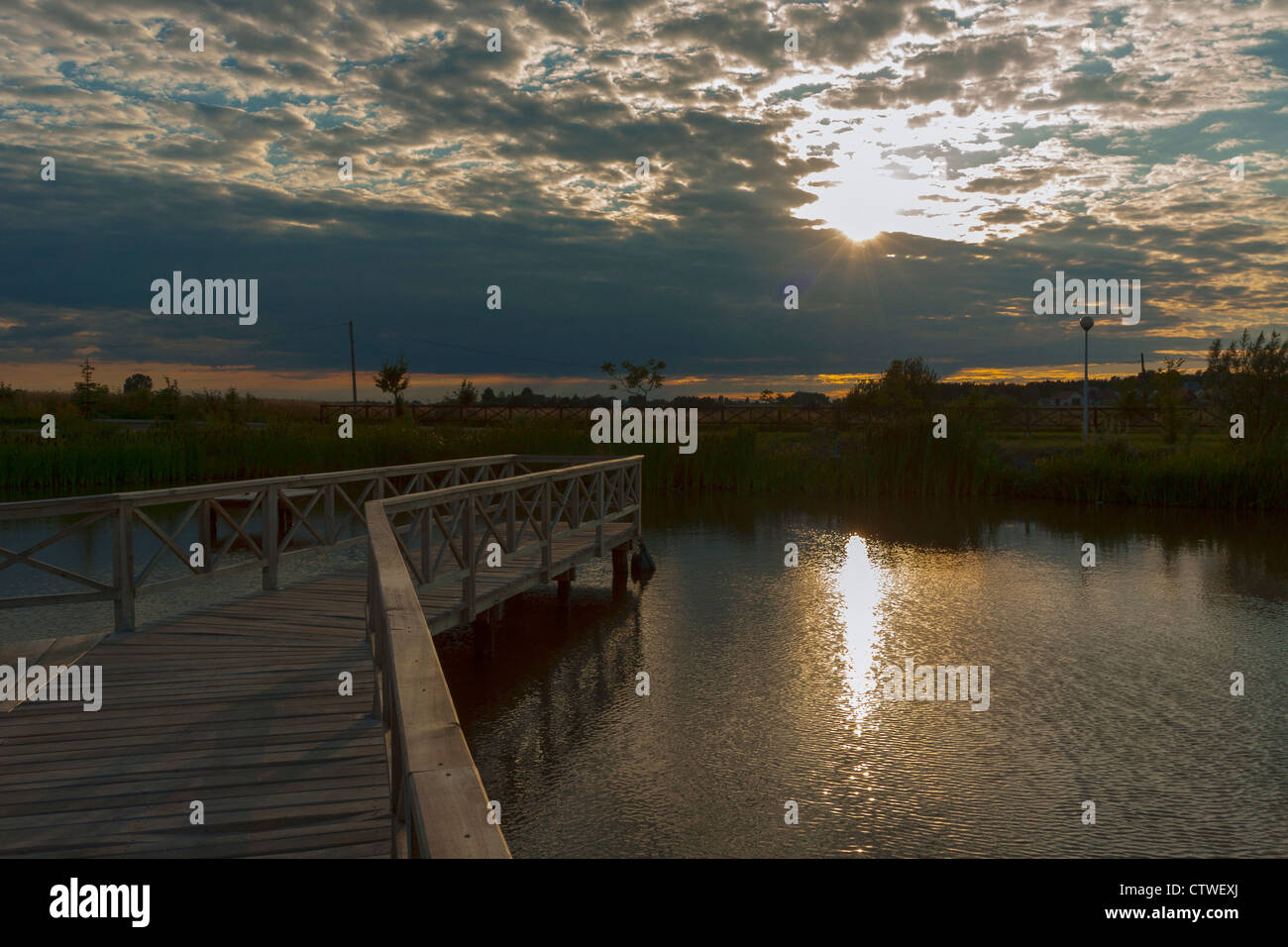 Sunrise over a pond Stock Photo - Alamy