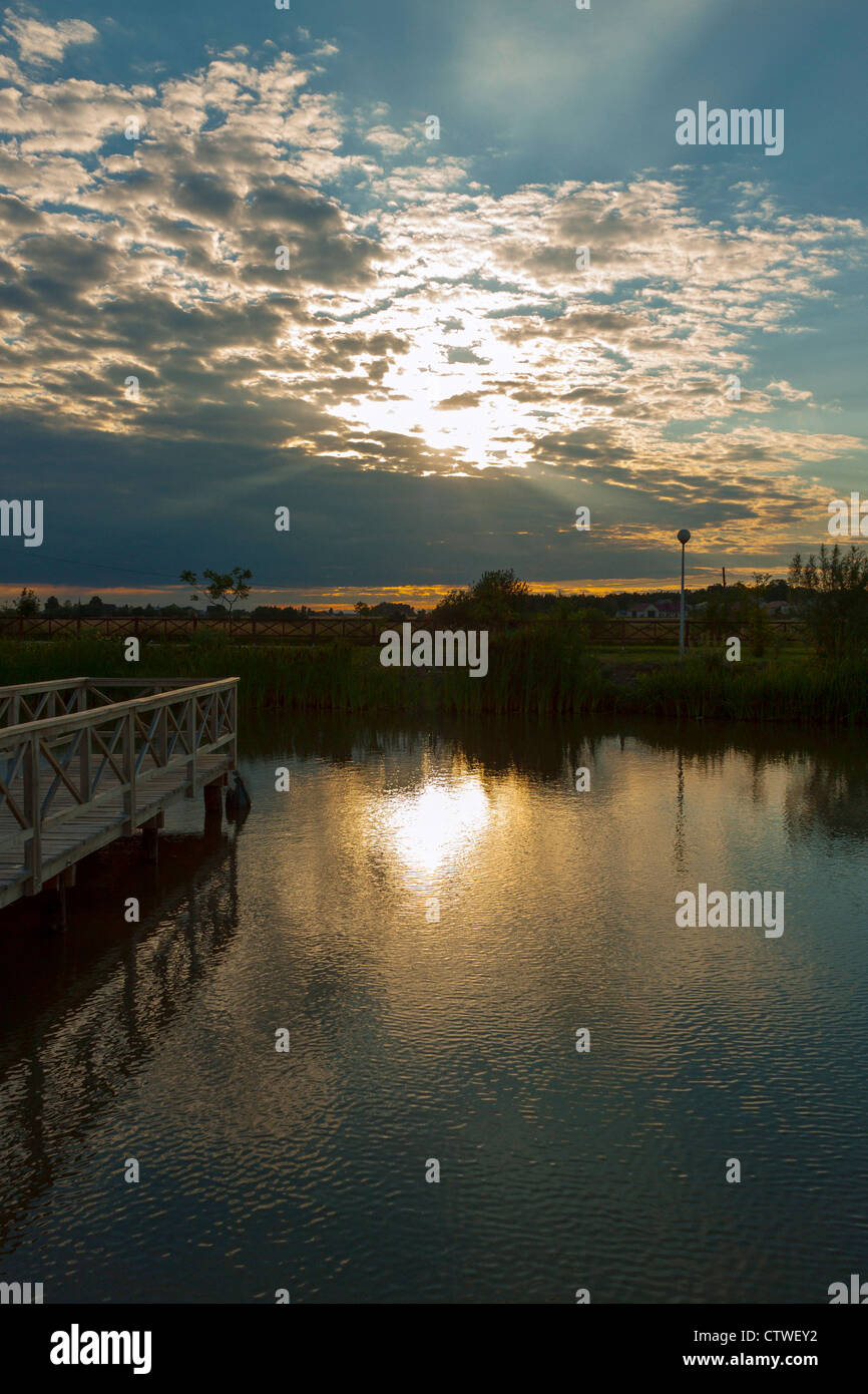 Sunrise over a pond Stock Photo - Alamy