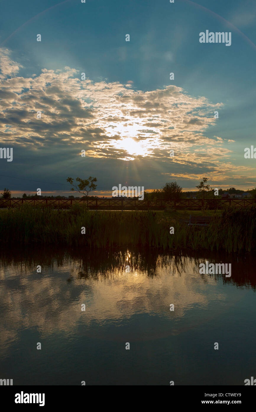 Sunrise over a pond Stock Photo - Alamy