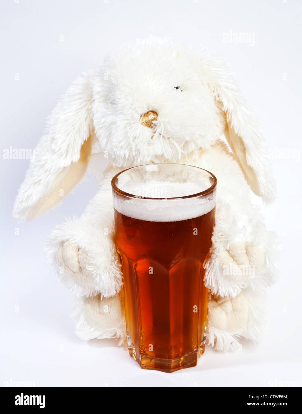 Toy rabbit with glass of beer Stock Photo - Alamy