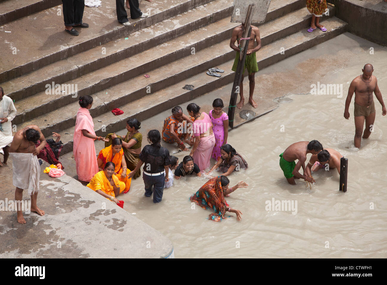 Indian people on the banks of the Ganges river Stock Photo - Alamy