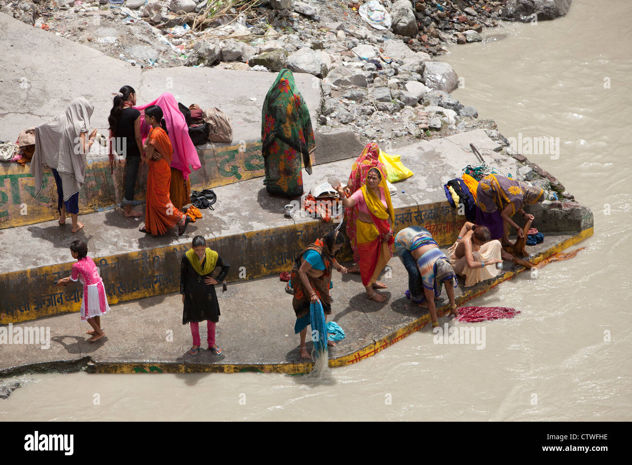 Indian people on the banks of the Ganges river Stock Photo - Alamy