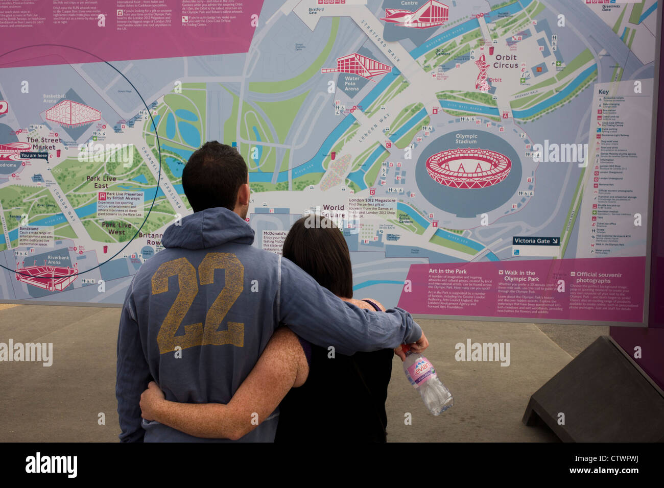 Spectators consult a detailed map of the Olympic Park during the London ...