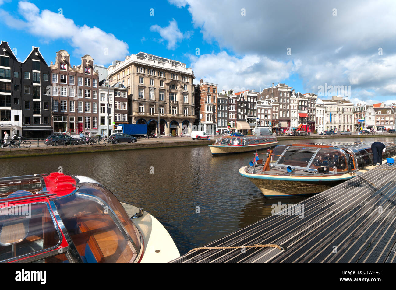 sightseeing boats in typical amsterdam canal Stock Photo - Alamy