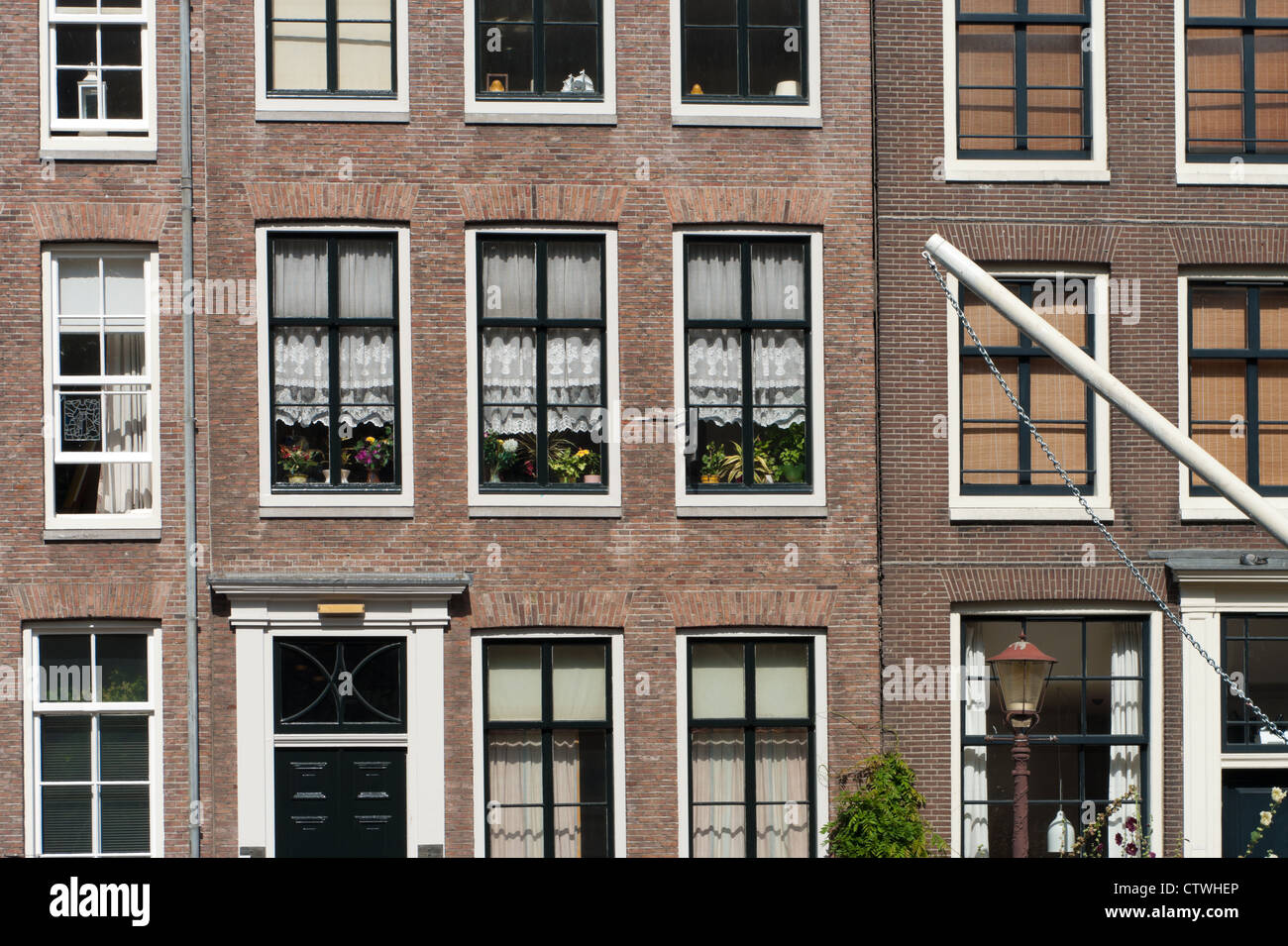 facade of amsterdam houses with similar windows Stock Photo - Alamy