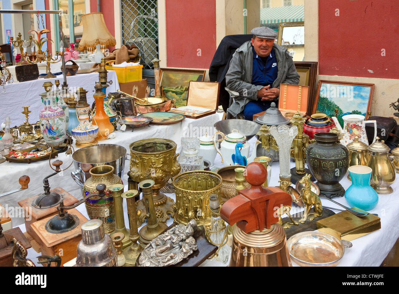 Stall holder with display of items for sale at the street market in ...