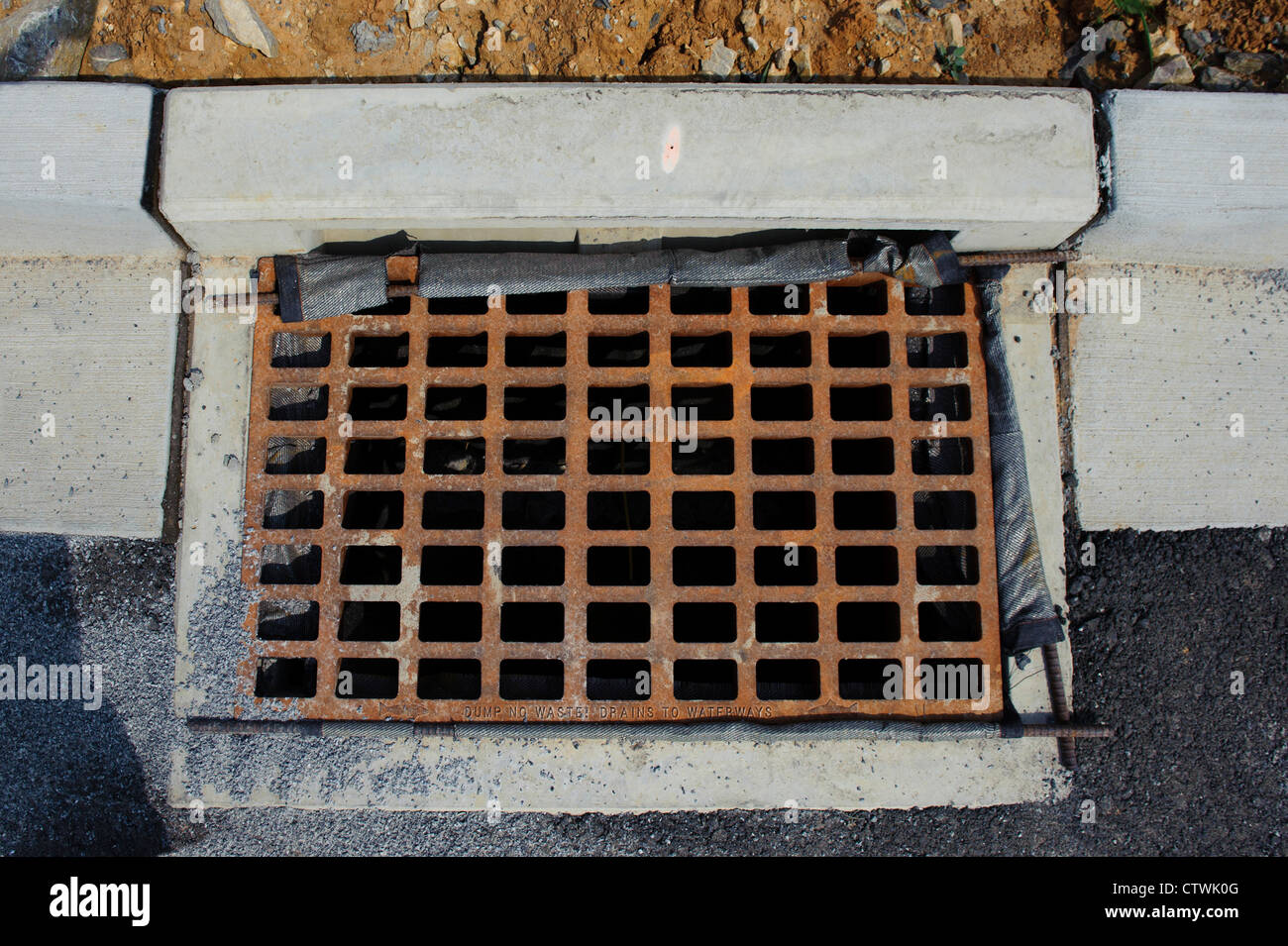 ROADSIDE STORM WATER DRAIN WITH DEBRIS FILTER HELD IN WITH REBAR POLES ...