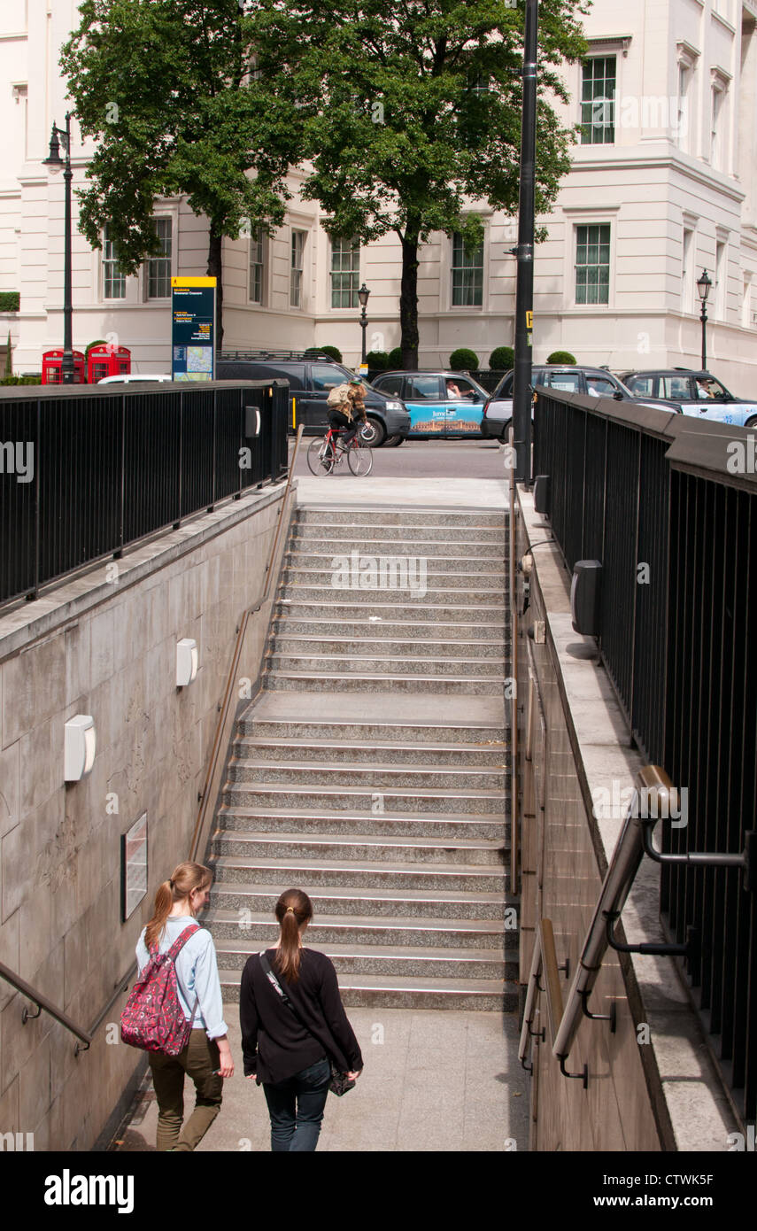 Two girls walking down the pedestrian underpass at Hyde Park Corner ...