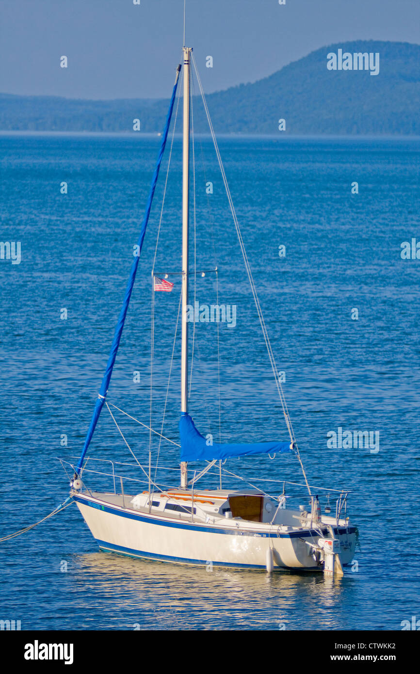 SAILBOAT ANCHORED IN WATER Stock Photo - Alamy