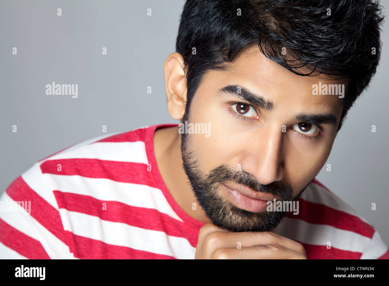 Portrait of a pensive young man Stock Photo - Alamy