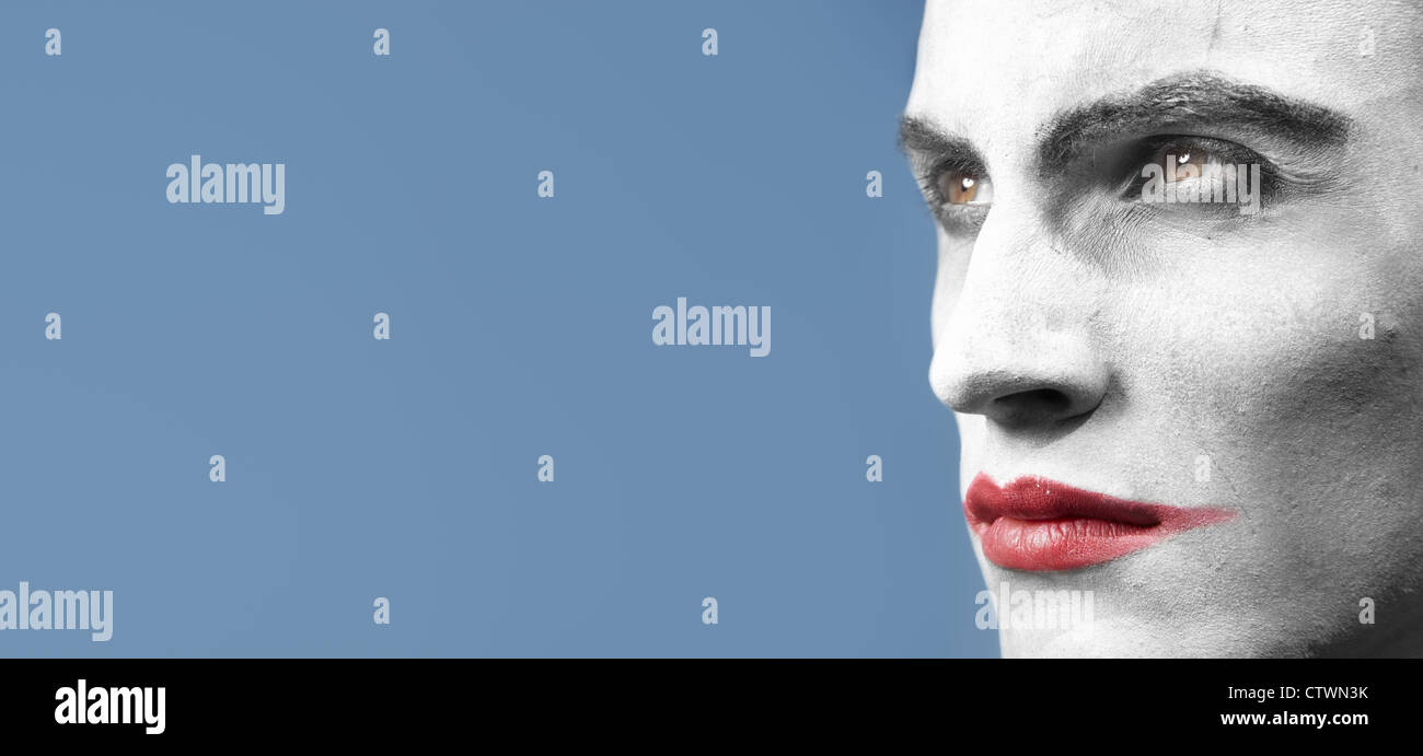 Face-painted man outdoors. Horizontal close-up photo with empty space ...