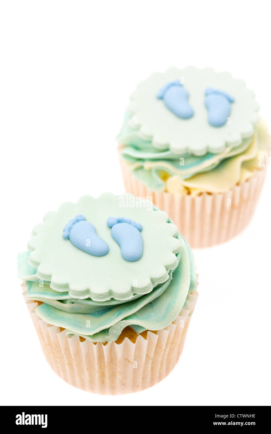 Cupcakes with two tiny blue baby feet made from icing placed on top of ...