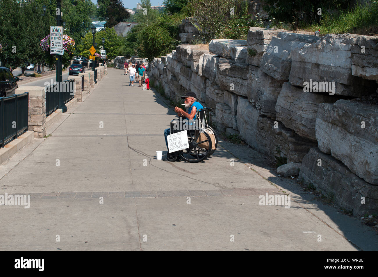 Old man on wheel chair asking for help hi-res stock photography and ...