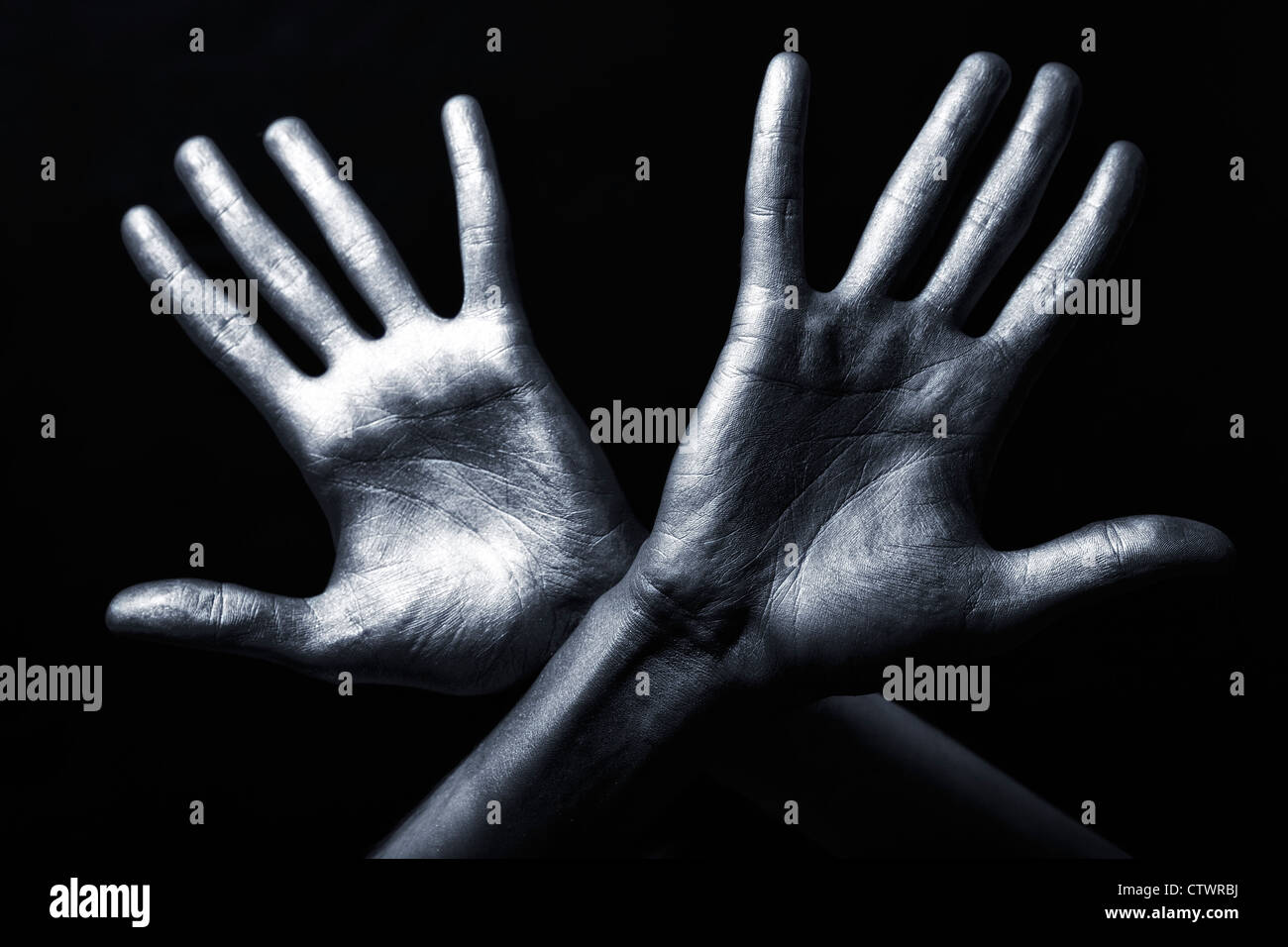 Men's hand in a silver paint isolated on black background Stock Photo ...