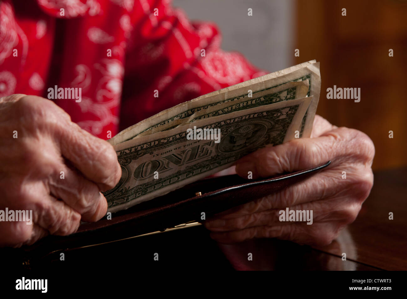 Elderly lady counting money hi-res stock photography and images - Alamy