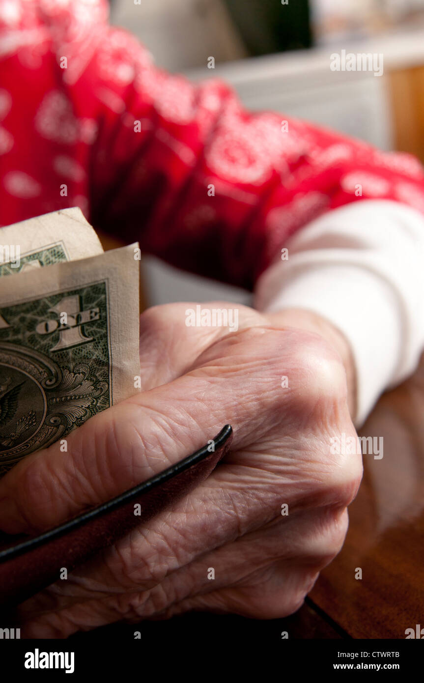 Elderly lady counting money hi-res stock photography and images - Alamy